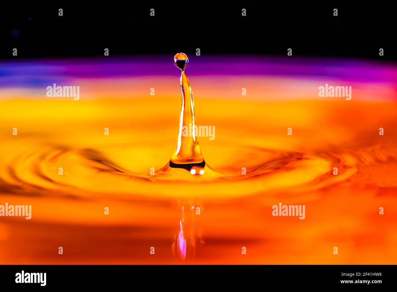 Colored water drop, circle ripples, splash of water, closeup Stock ...