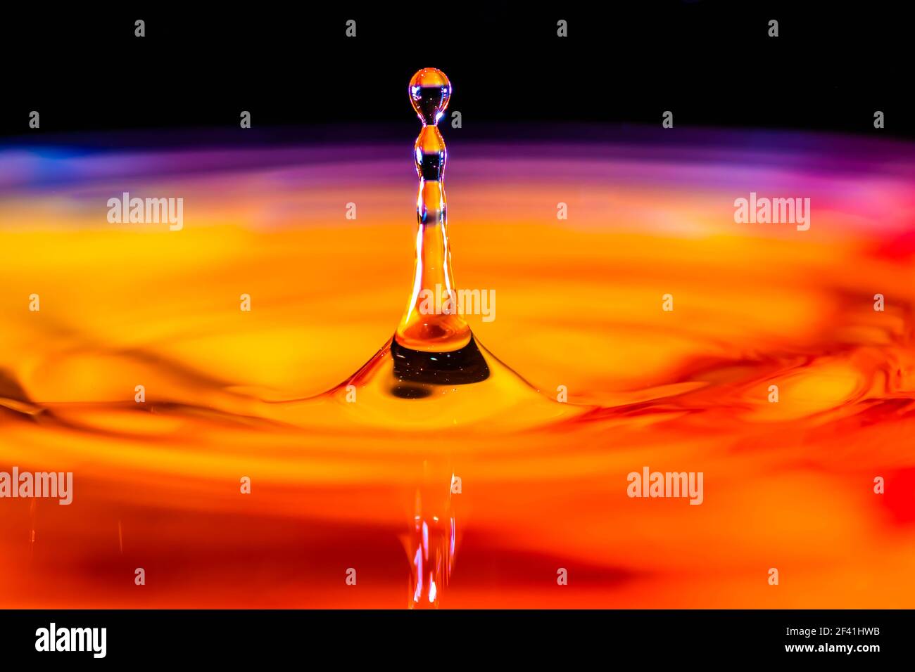 Colored water drop, circle ripples, splash of water, closeup Stock ...