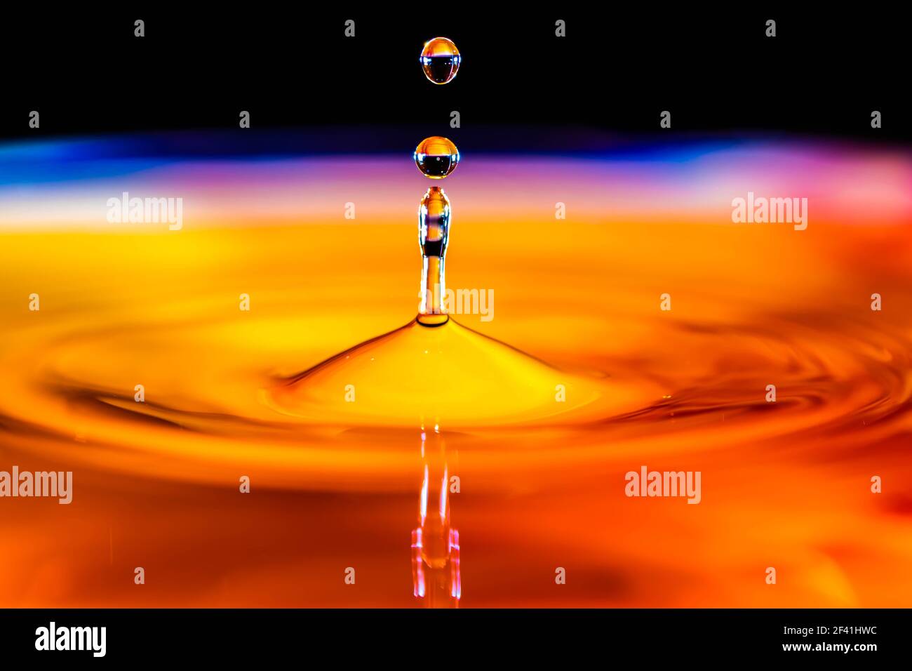 Colored water drop, circle ripples, splash of water, closeup Stock ...