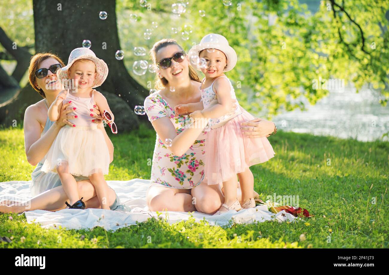 Two young women with soap bubble hi-res stock photography and images ...