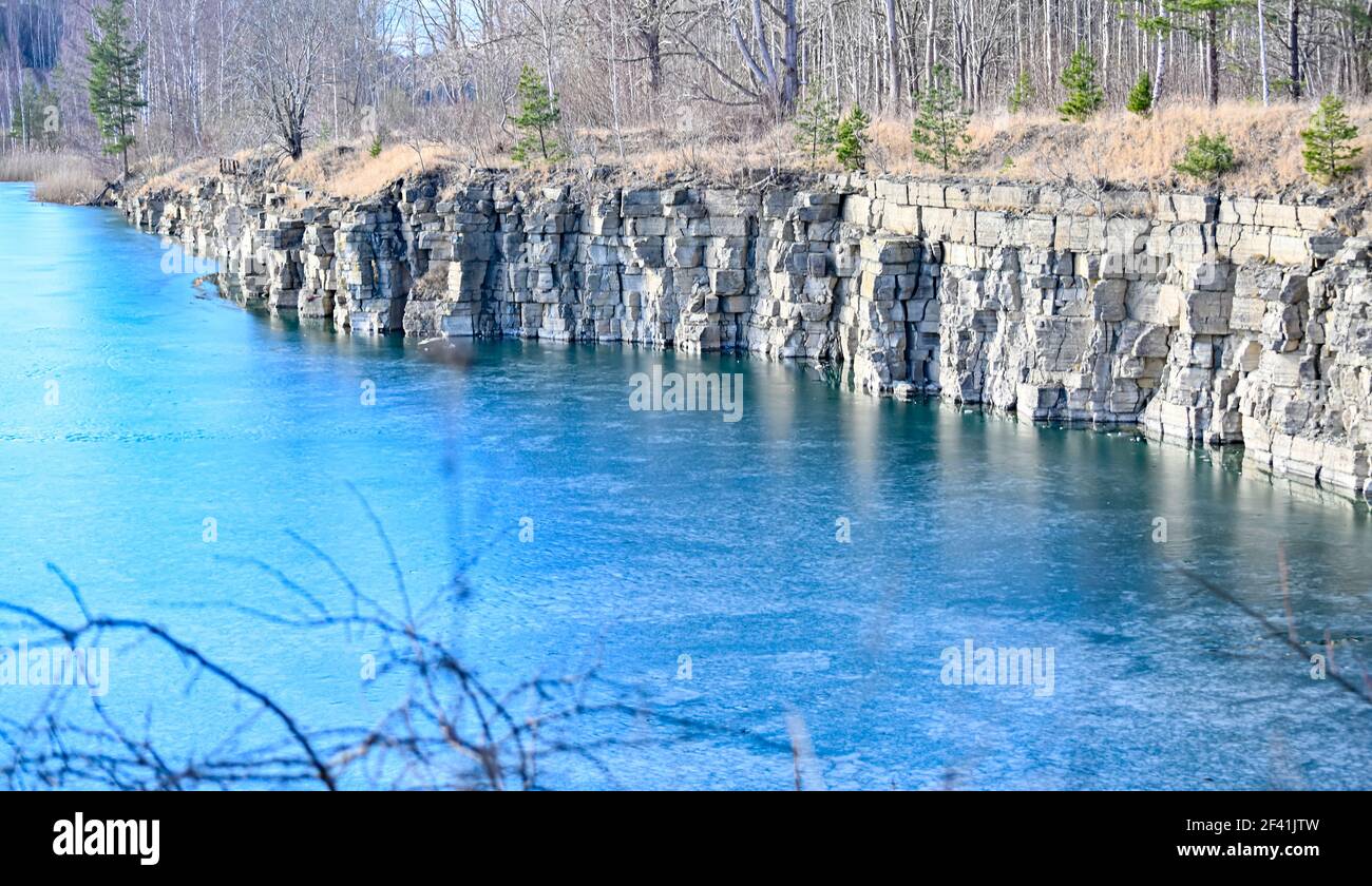 overlooking old open pit with frozen ice Stock Photo - Alamy