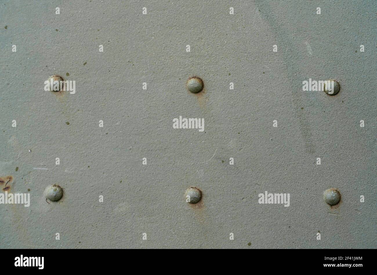 Abstract green industrial metal background texture with bolts and ...