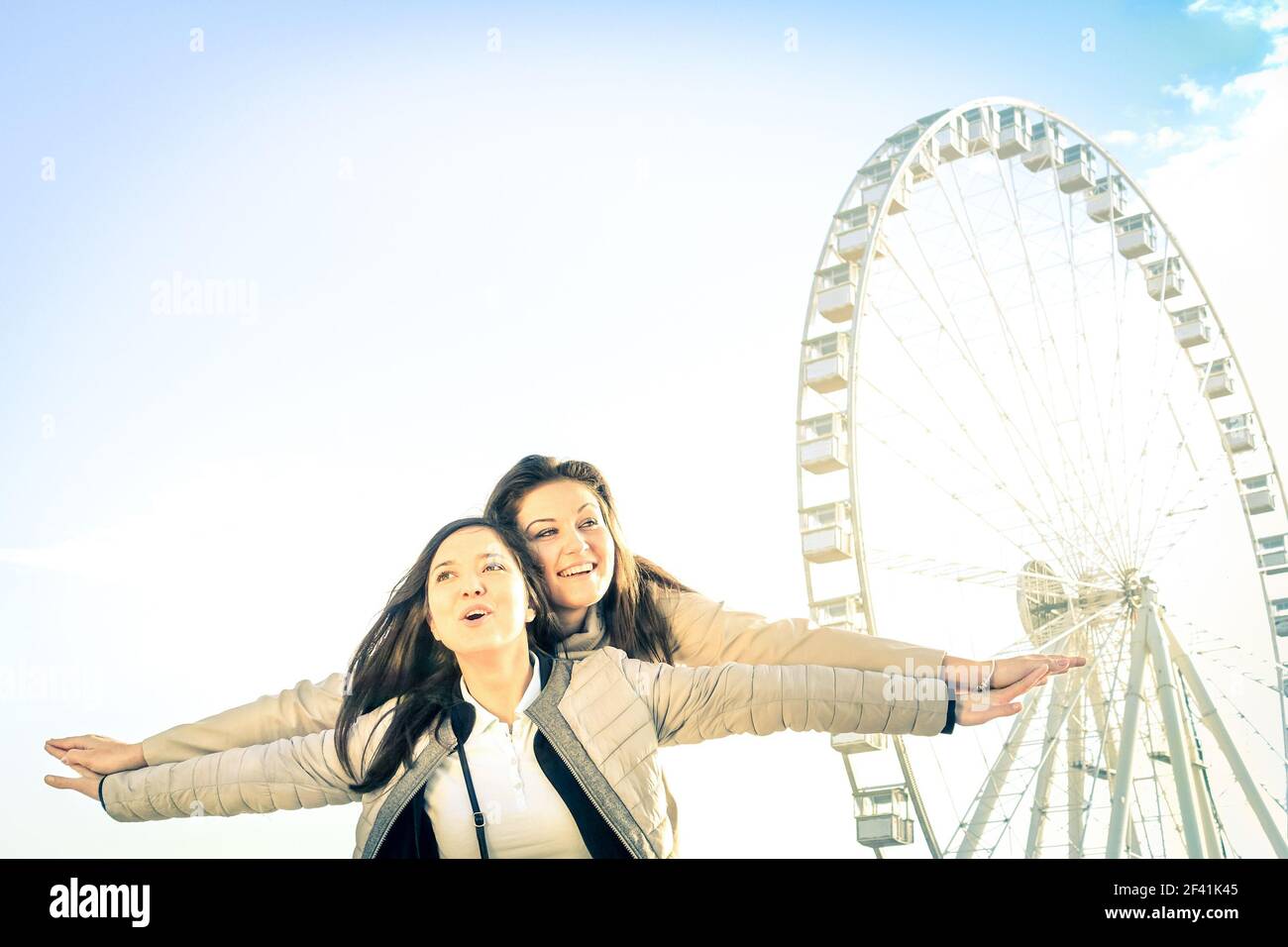 Best female friends enjoying time together outdoors at luna park ...