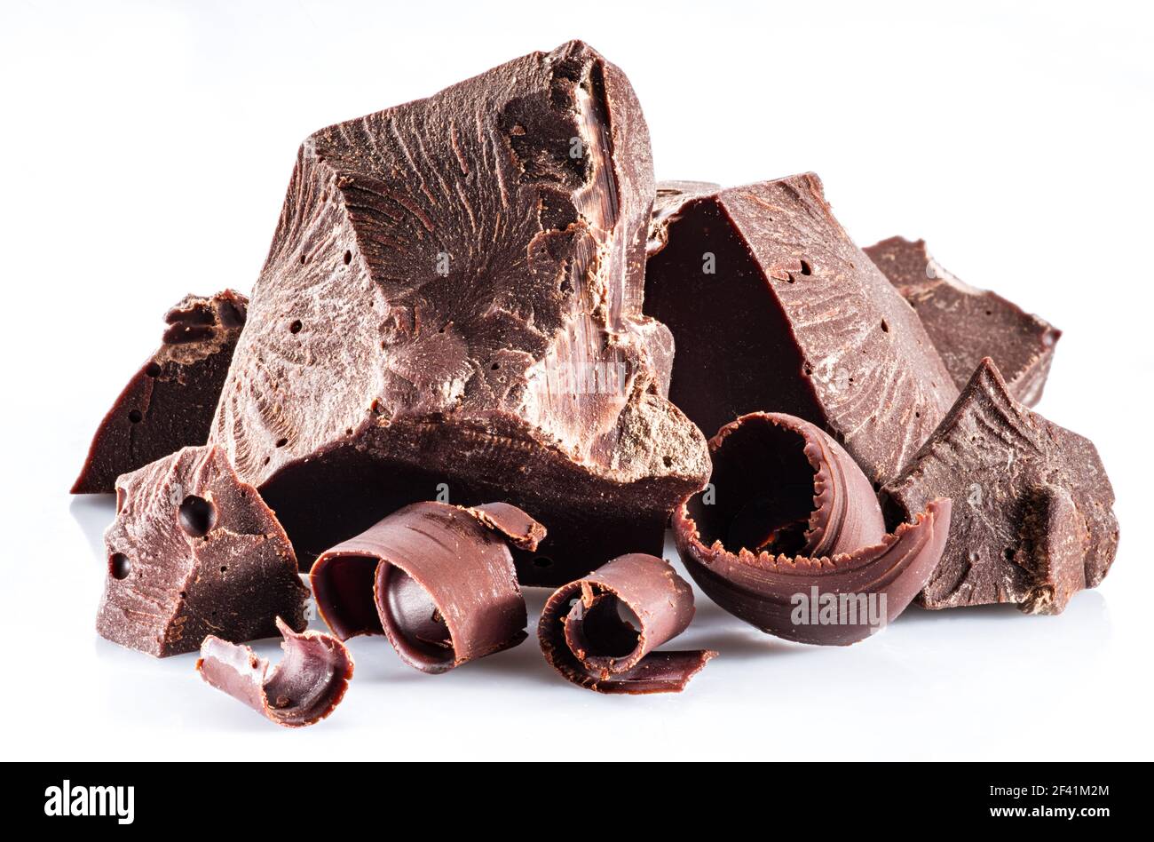 Pieces of dark chocolate with chocolate chips isolated on a white ...