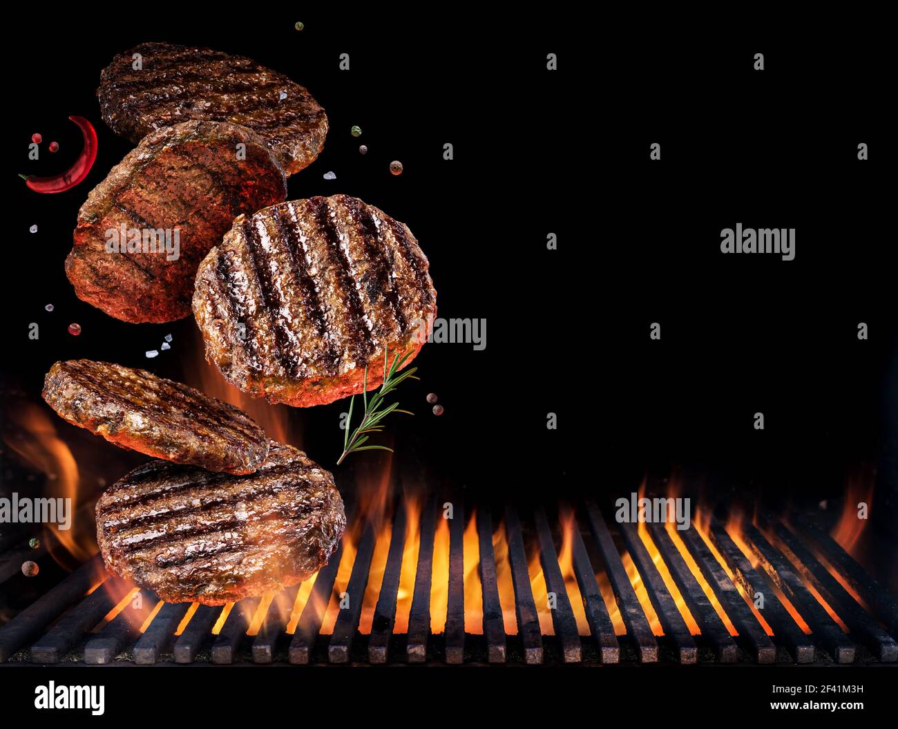 Grilled beef steaks in motion falling down on open grill. Conceptual ...