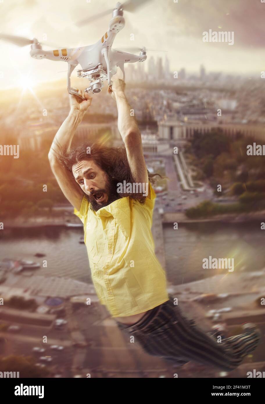 Conceptual portrait of a guy flying with a drone Stock Photo - Alamy