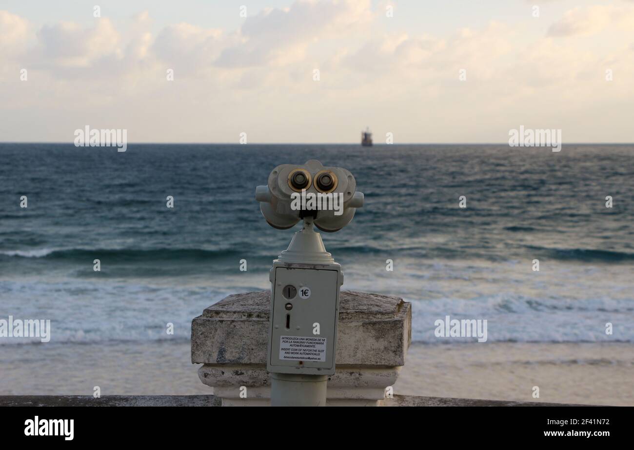 Coin operated metal Tower viewer binoculars on a stalk on the seafront ...