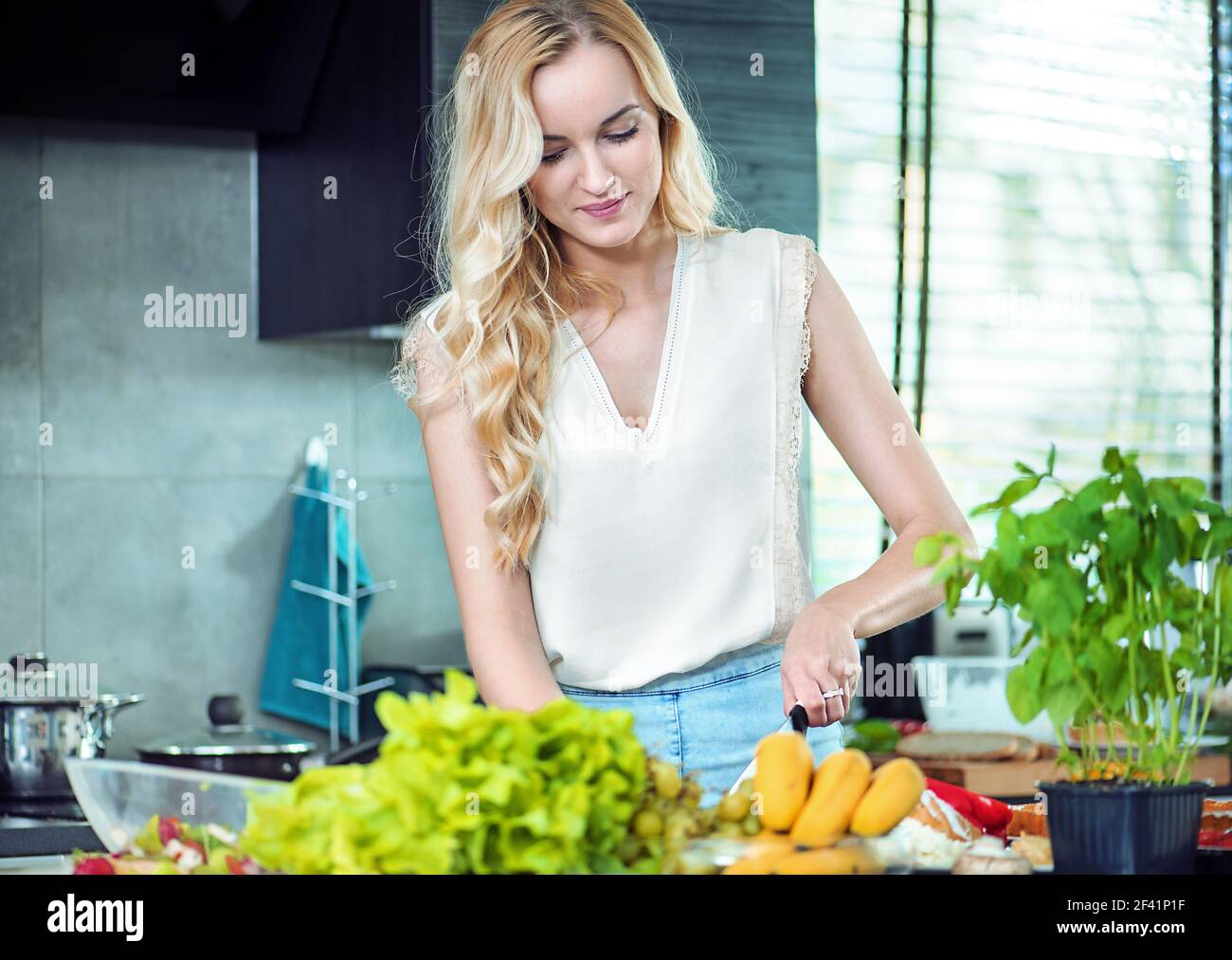 Young woman preparing vegetables hi-res stock photography and images ...