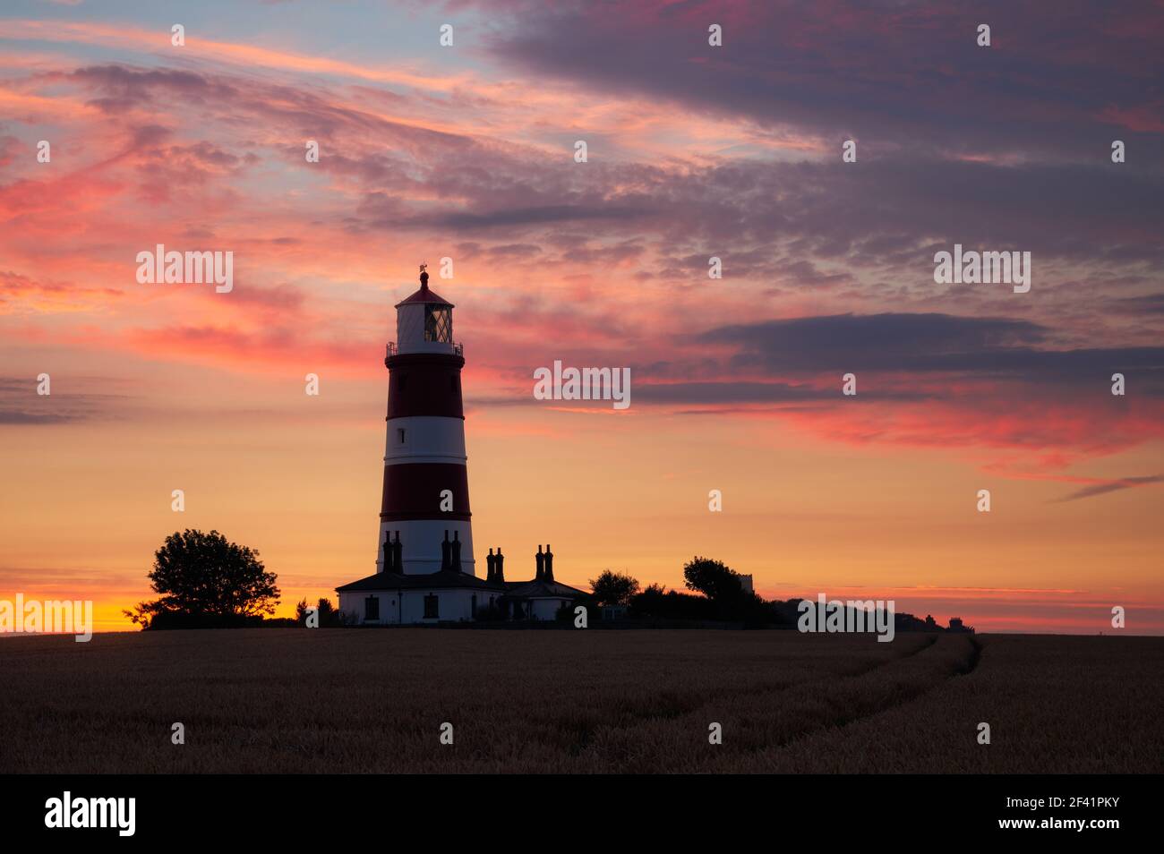 Happisburgh lighthouse on the East Coast of England surrounded by a ...