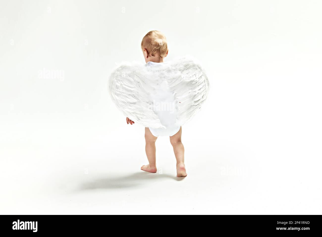 Portrait of a happy little baby angel Stock Photo - Alamy