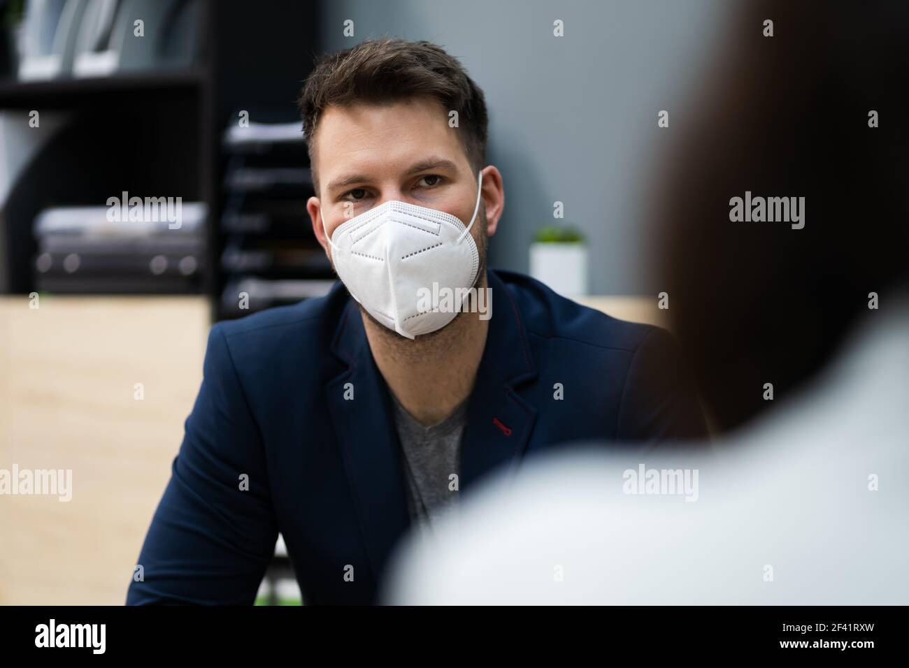 Employee Job Interview In Covid FFP2 Face Mask Stock Photo - Alamy