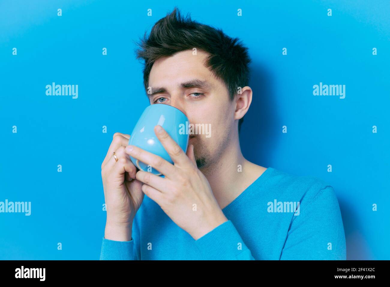 Man with cup Stock Photo - Alamy