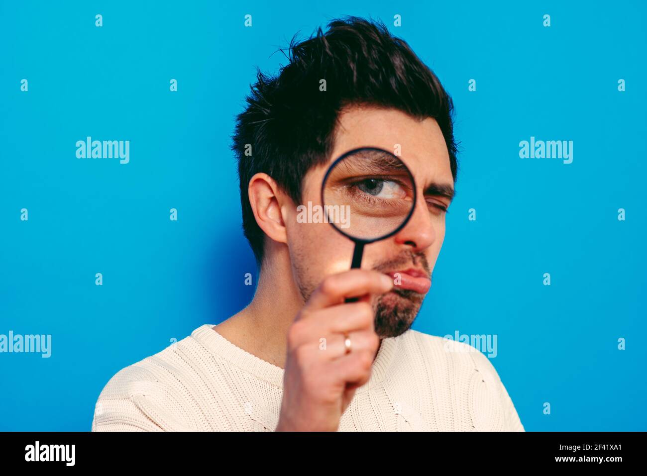The man with a magnifier Stock Photo - Alamy