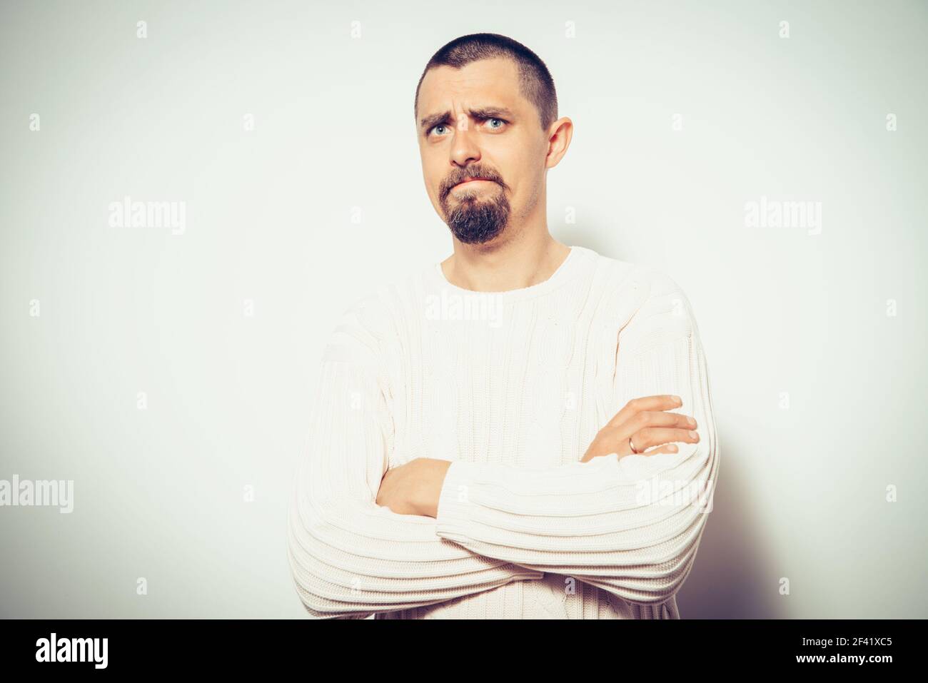 Folded hands young man hi-res stock photography and images - Alamy