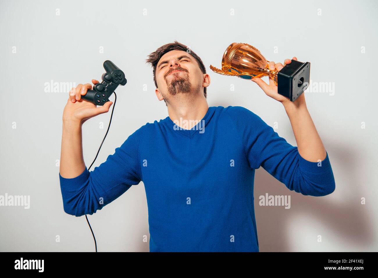 Man with a joystick . Man with a joystick and cup Stock Photo - Alamy