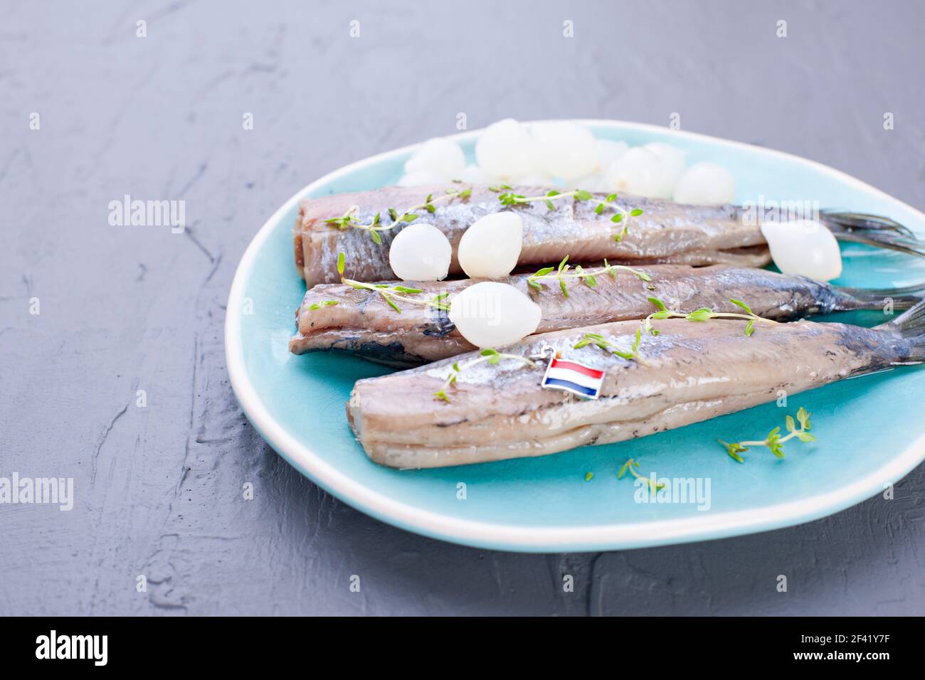 Dutch herring on the plate. Traditional Dutch food, marinated fish ...