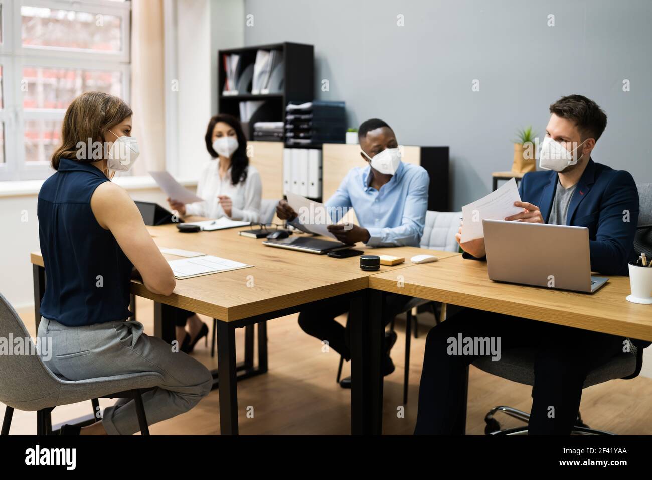 Business Manager Job Interview Talking In Face Mask Stock Photo - Alamy