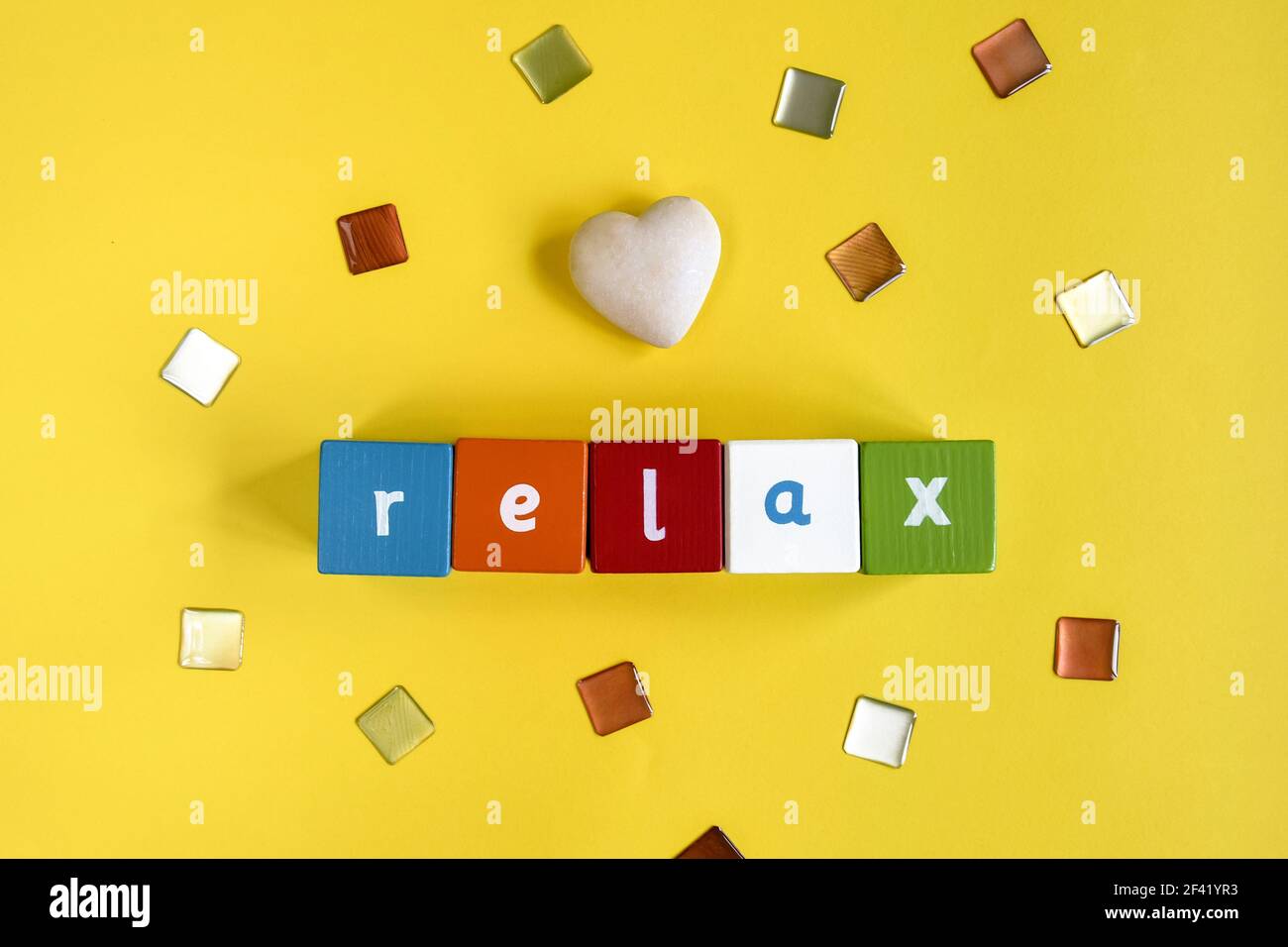 RELAX - Word made from colored wooden blocks. Painted cubes with ...
