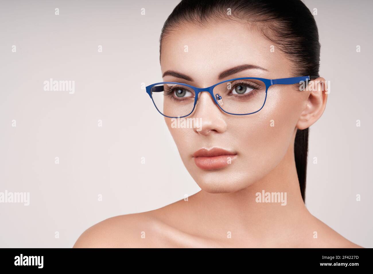 Woman with long eyelashes in eyeglasses. Vision correction. Poor ...