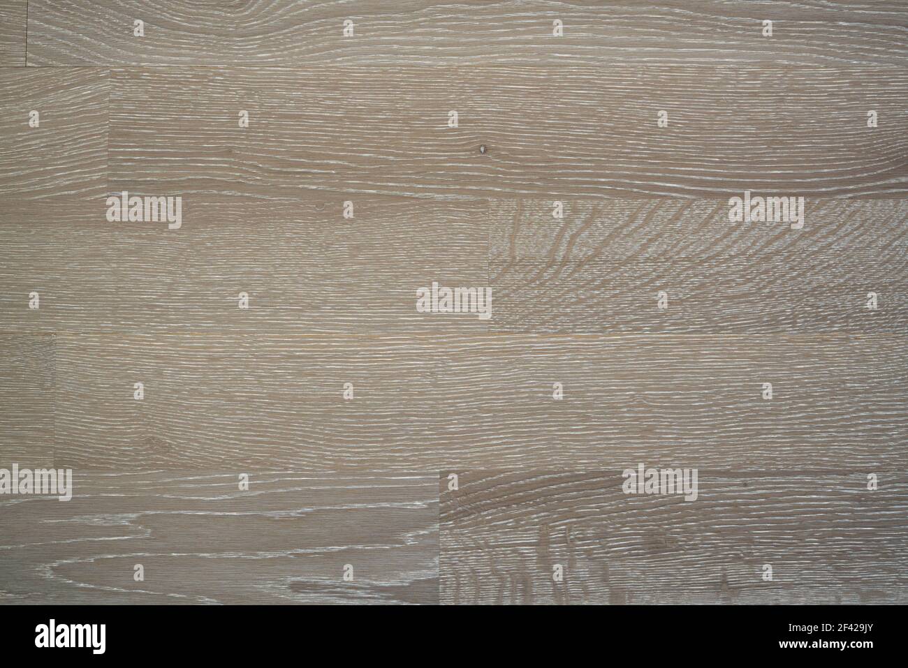 The flooring is made of natural oak with a gray tint and a white patina ...
