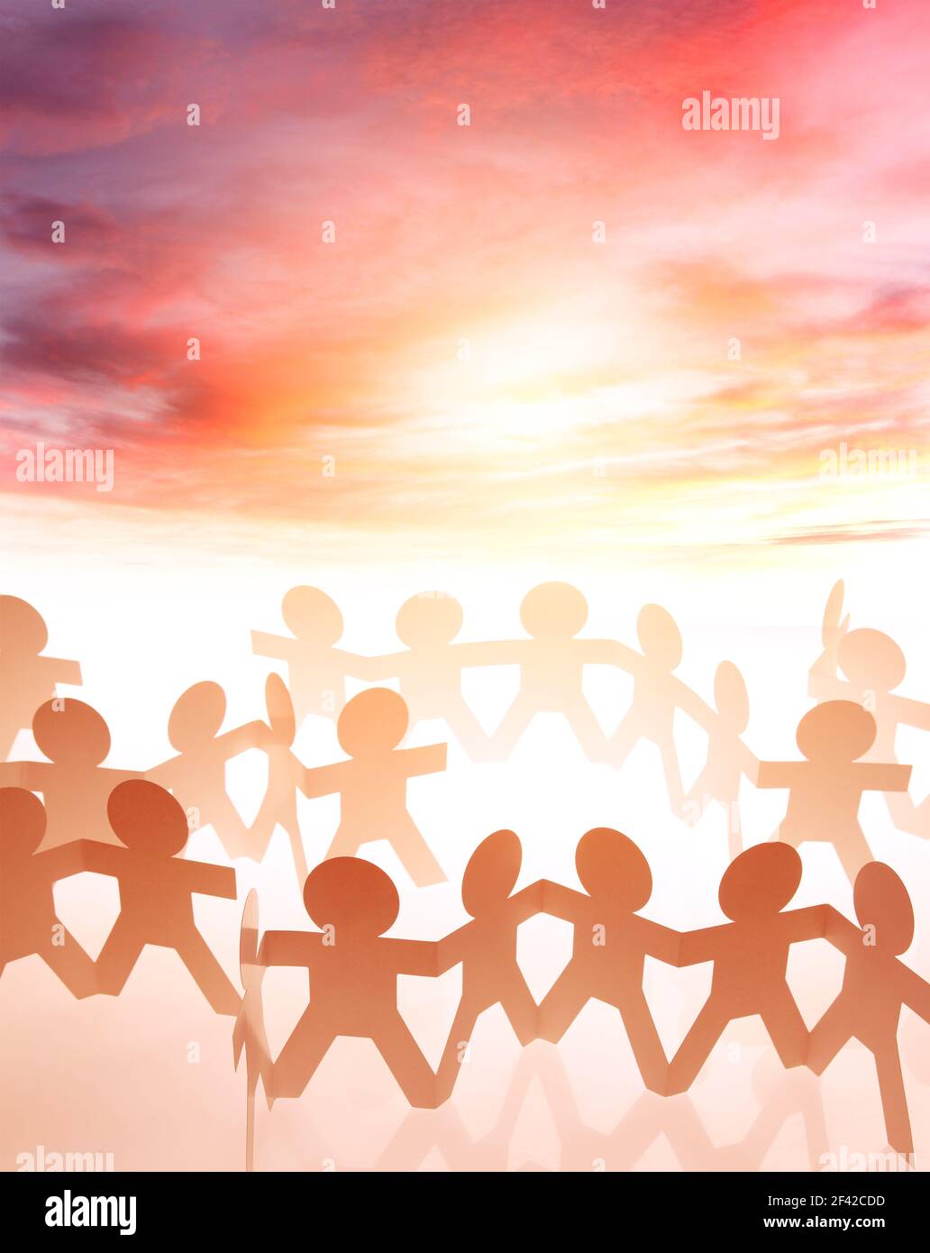 Paper chain team holding hands and sky. Teamwork. Partnership Stock ...