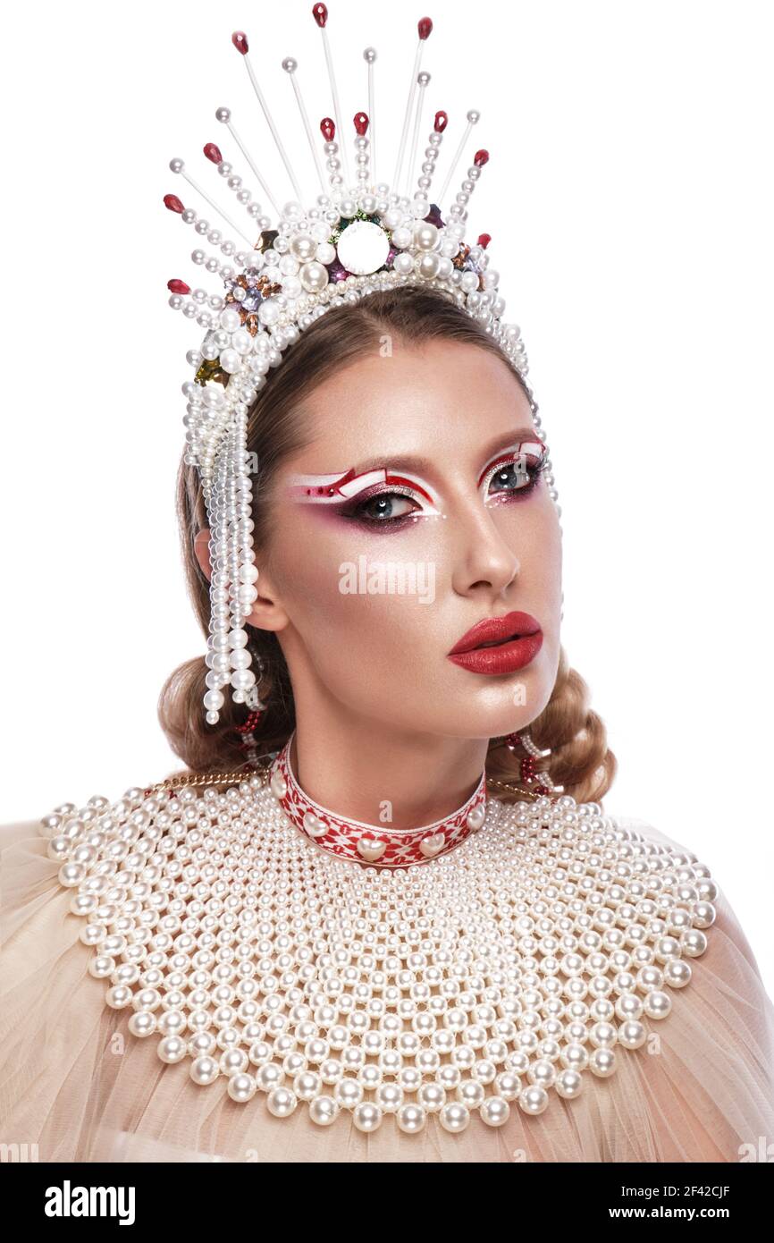 Beautiful woman in a creative style with bright makeup and white ...