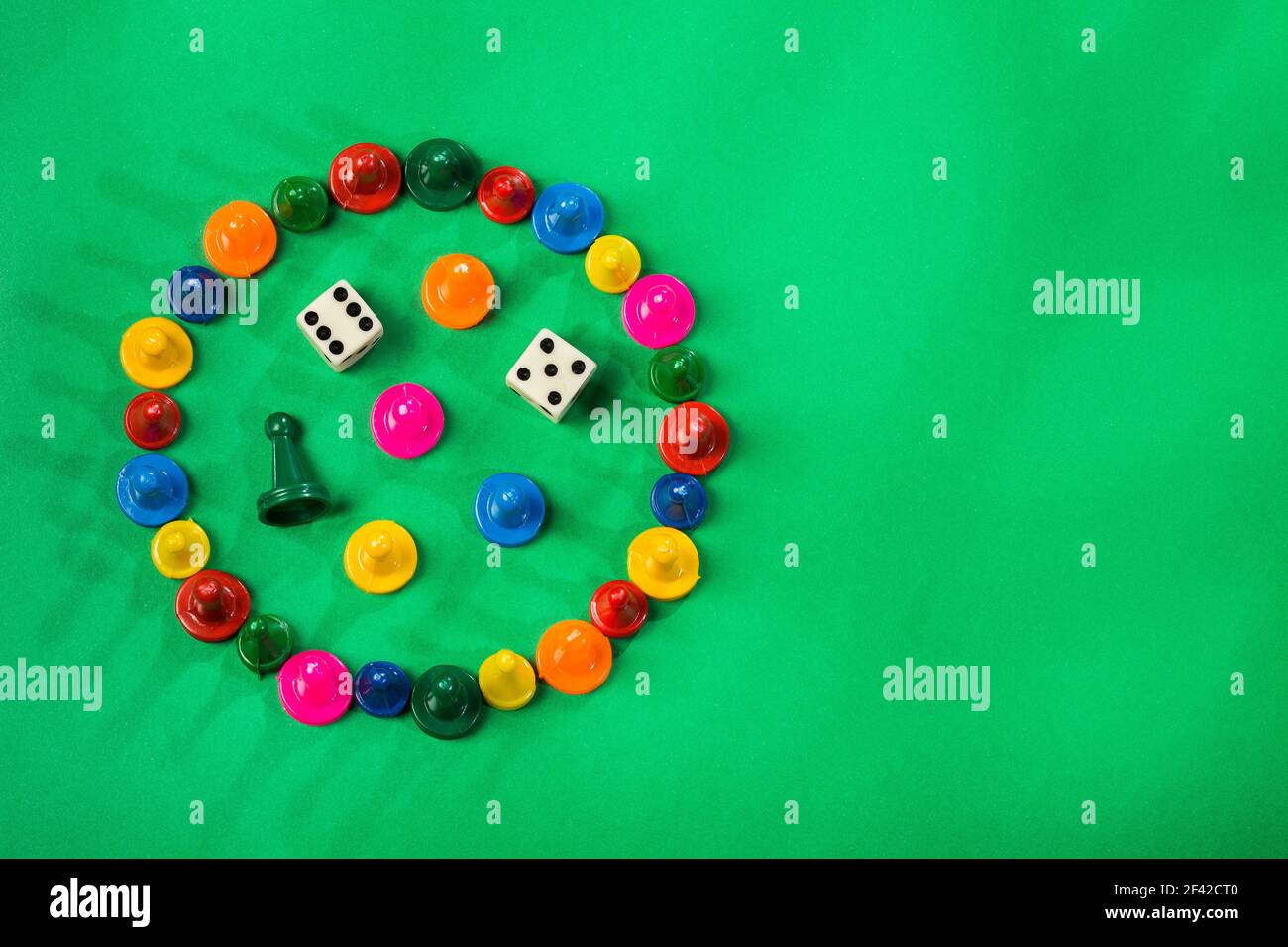 Colorful game pieces and dice Stock Photo - Alamy