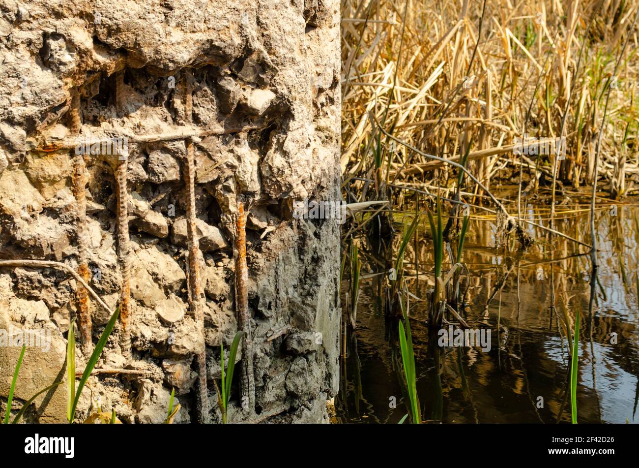 Destruction of the reinforced concrete column of the bridge. Bridge ...