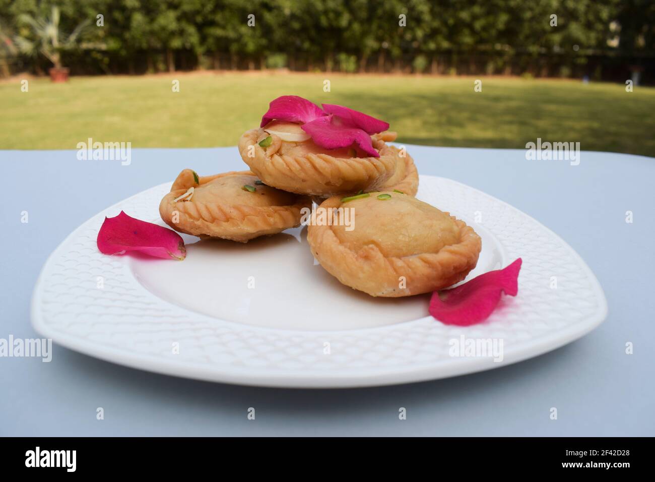 Indian traditional sweet known as Chandrakala, round deep fried sweet ...