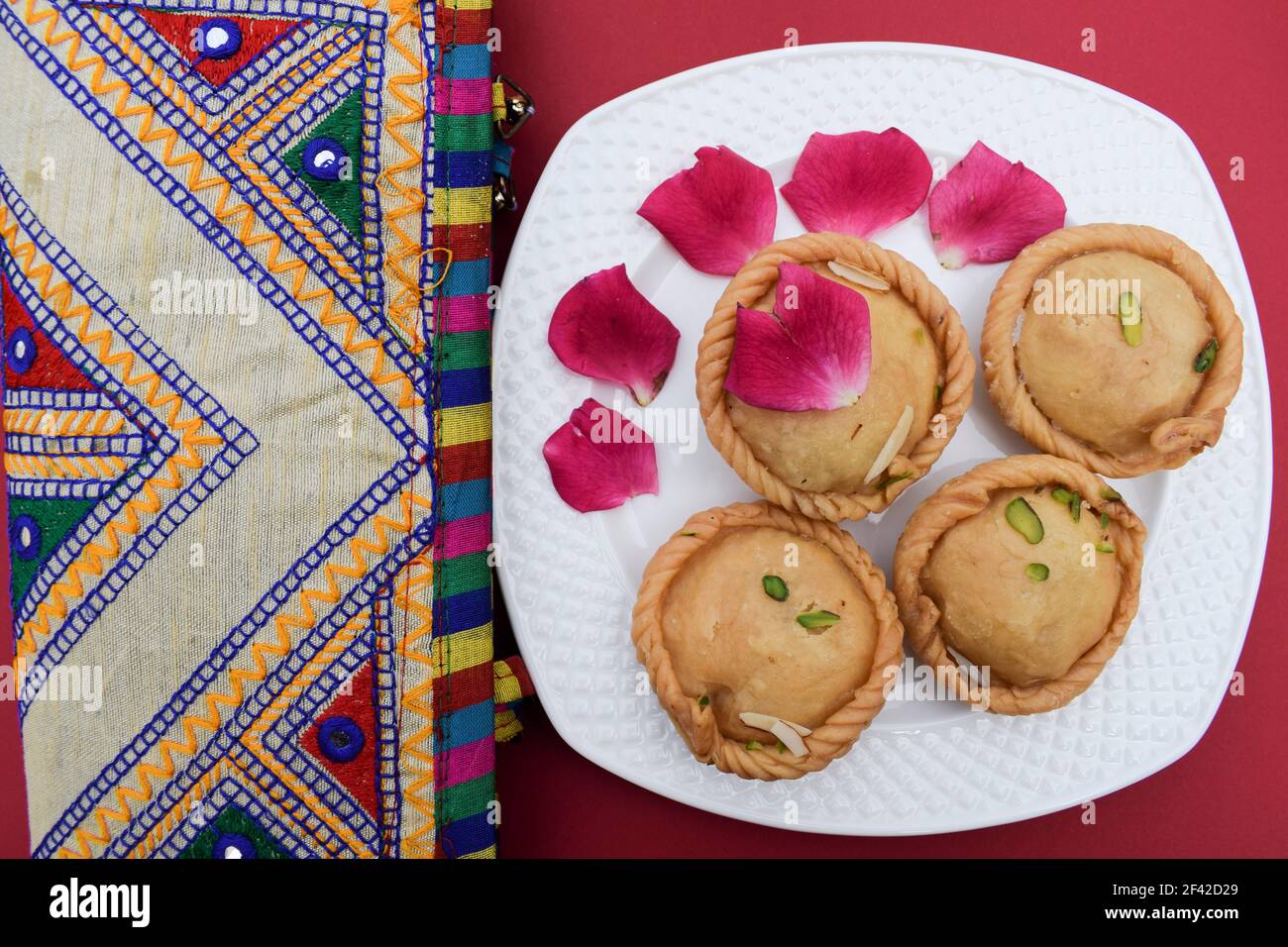 Indian traditional sweet known as Chandrakala, round deep fried sweet ...