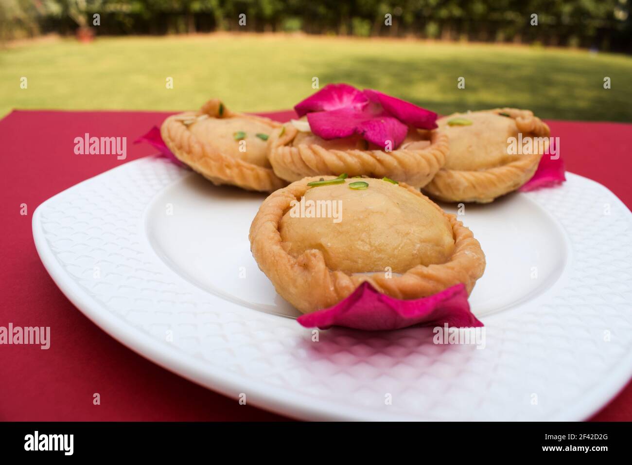 Indian traditional sweet known as Chandrakala, round deep fried sweet ...