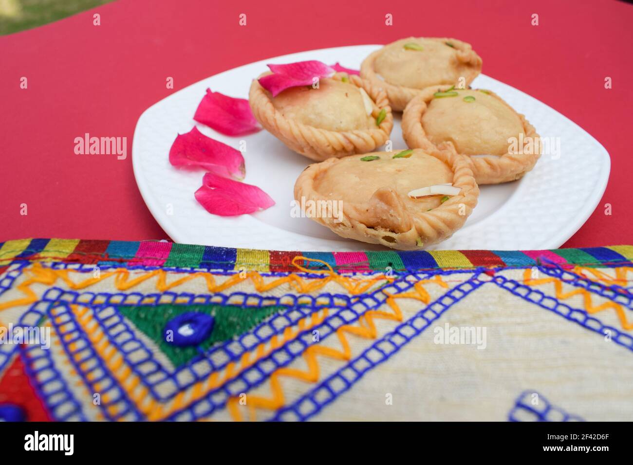 Indian traditional sweet known as Chandrakala, round deep fried sweet ...