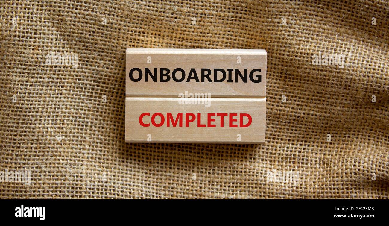 Onboarding completed symbol. Wooden blocks with words 'Onboarding ...