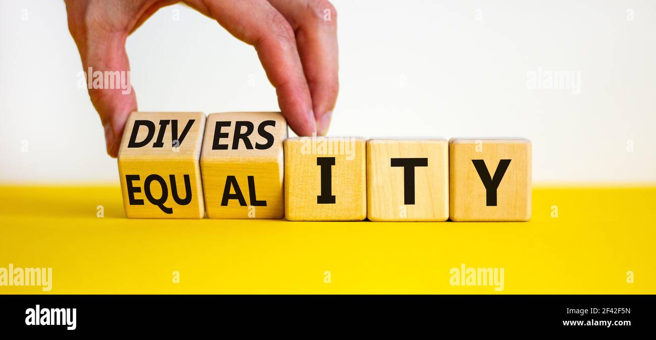 Diversity and equality symbol. Businessman turns wooden cubes, changes ...