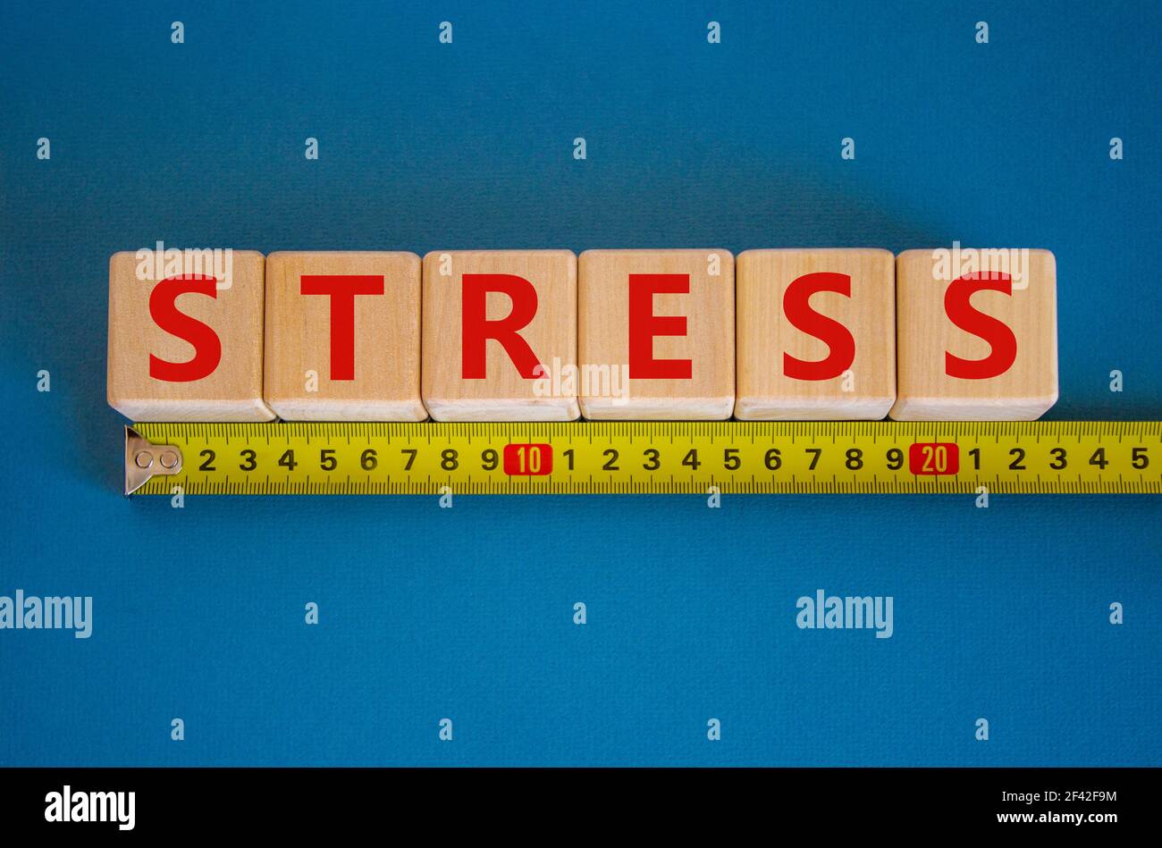 Stop stress and be health symbol. Wooden cubes with the word 'stress ...