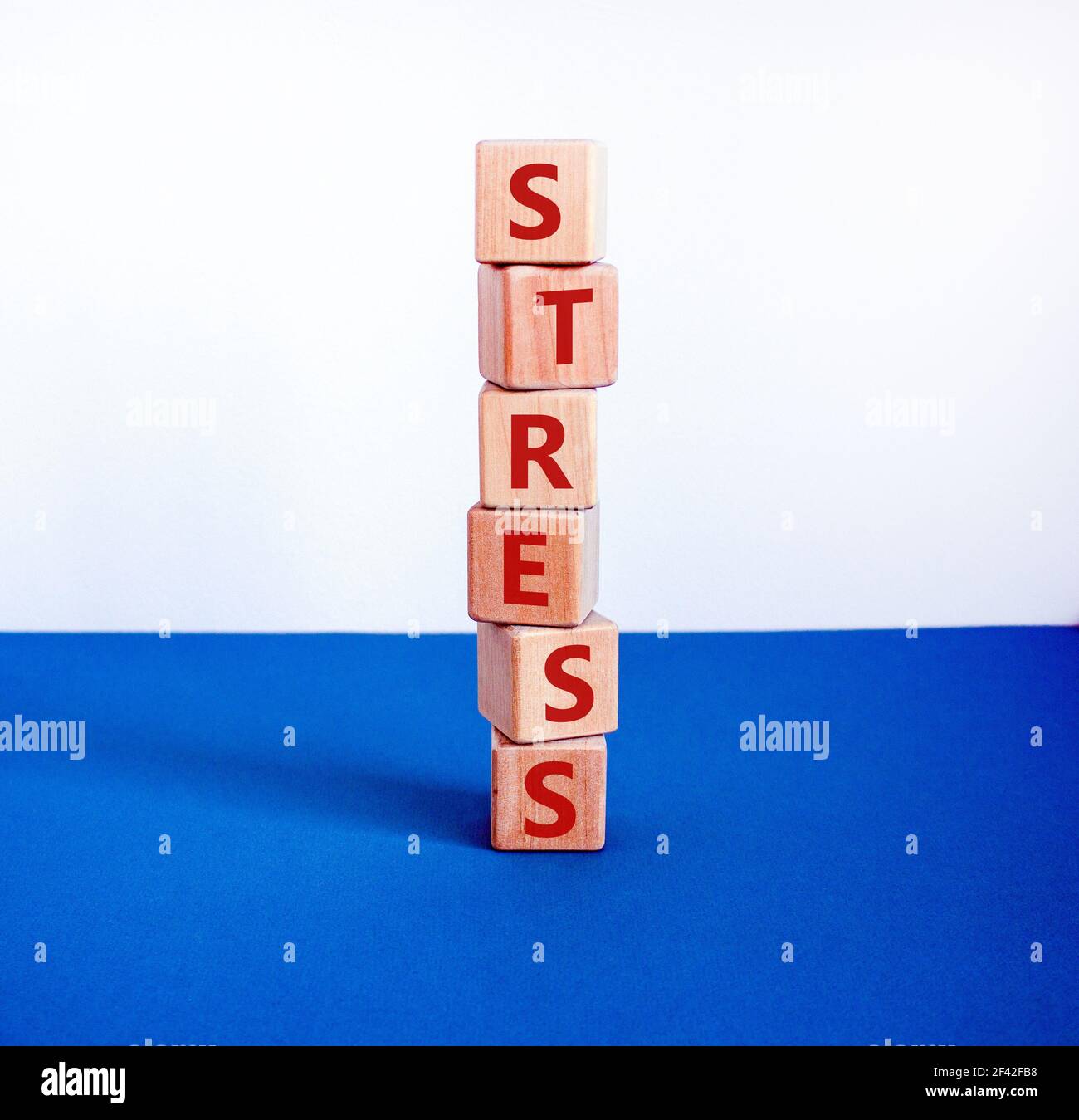 Stop stress and be health symbol. Wooden cubes with the word 'stress ...