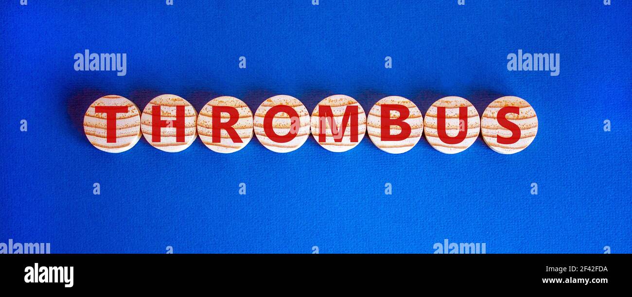 Medical and and thrombus symbol. Wooden circles with the word 'thrombus ...
