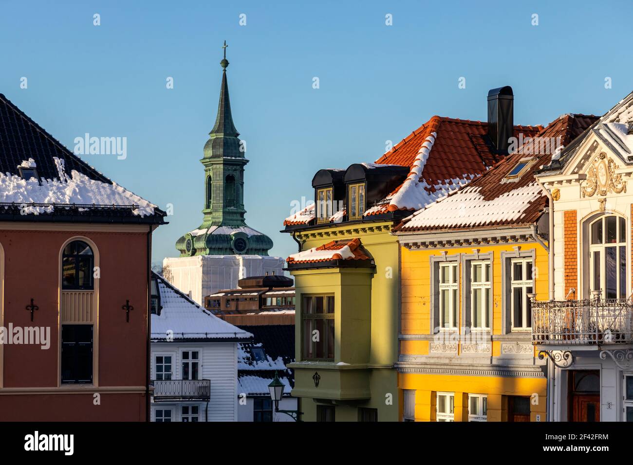 Tower of Nykirken white stone parish church in the port area of Nordnes ...