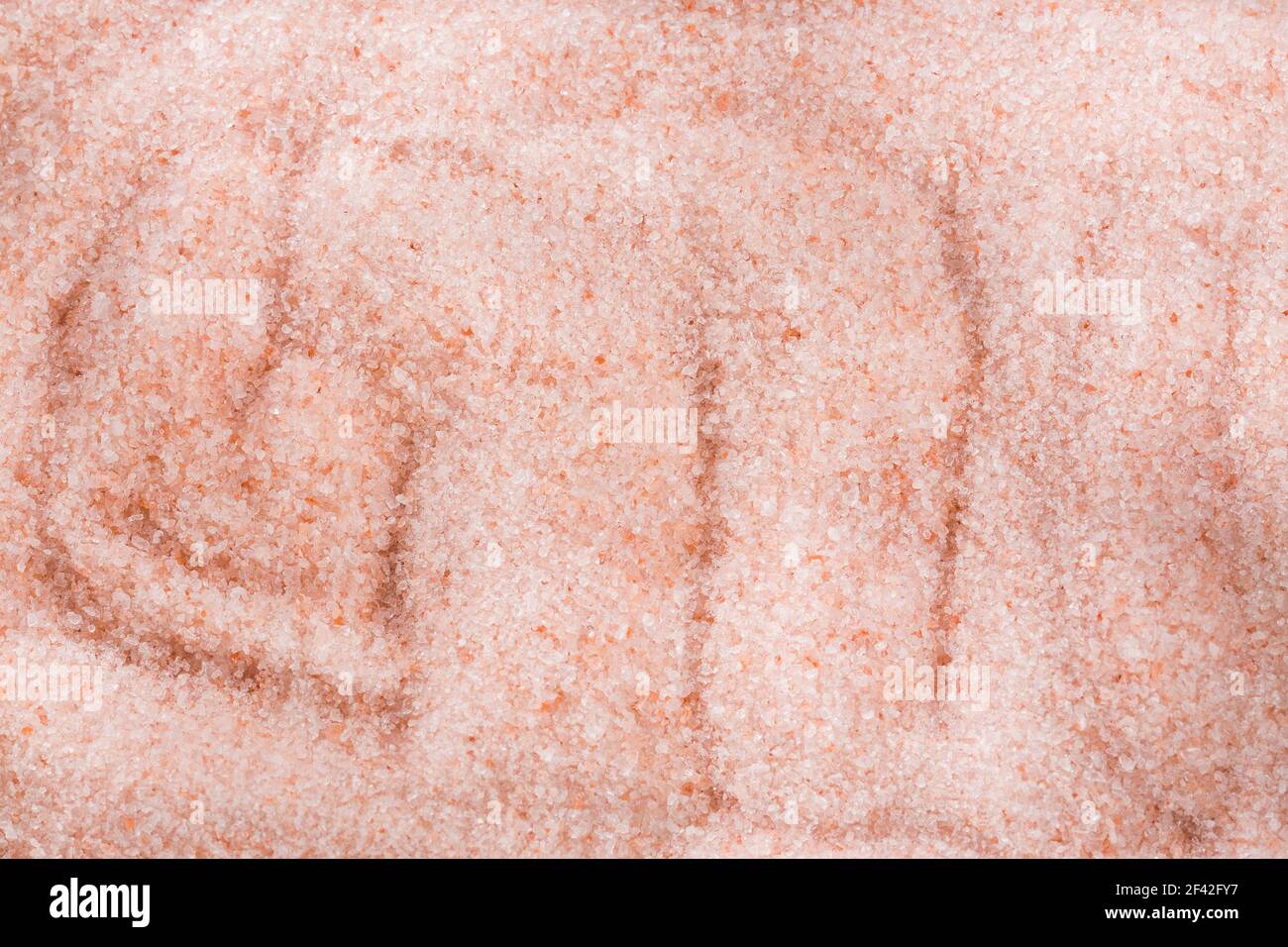 Fine grains of pink Himalayan salt, powder red rock salt from Pakistan ...