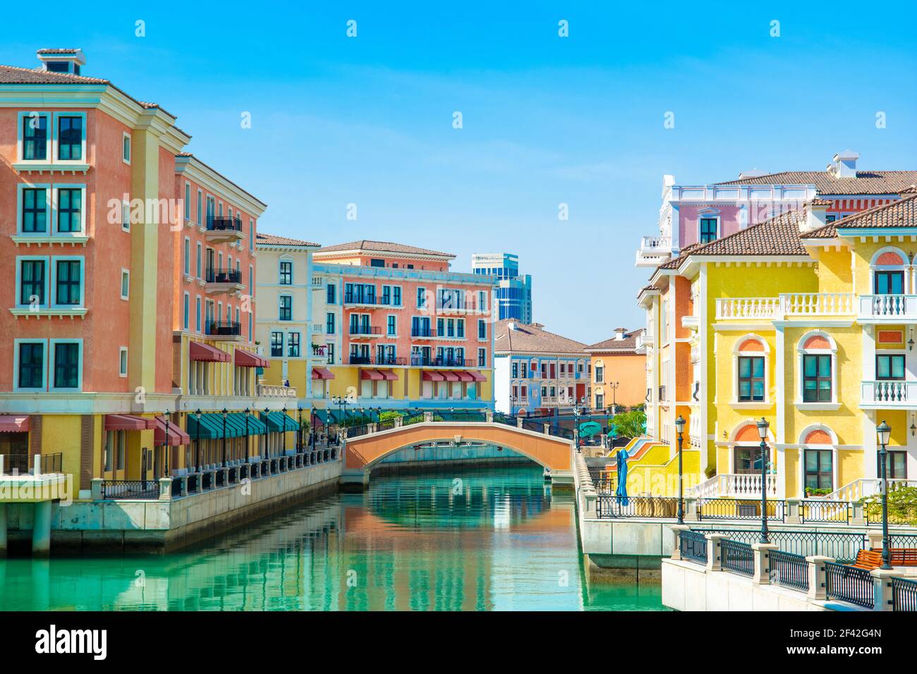 Colorful waterfront buildings in venetian style in the Qanat Quartier ...