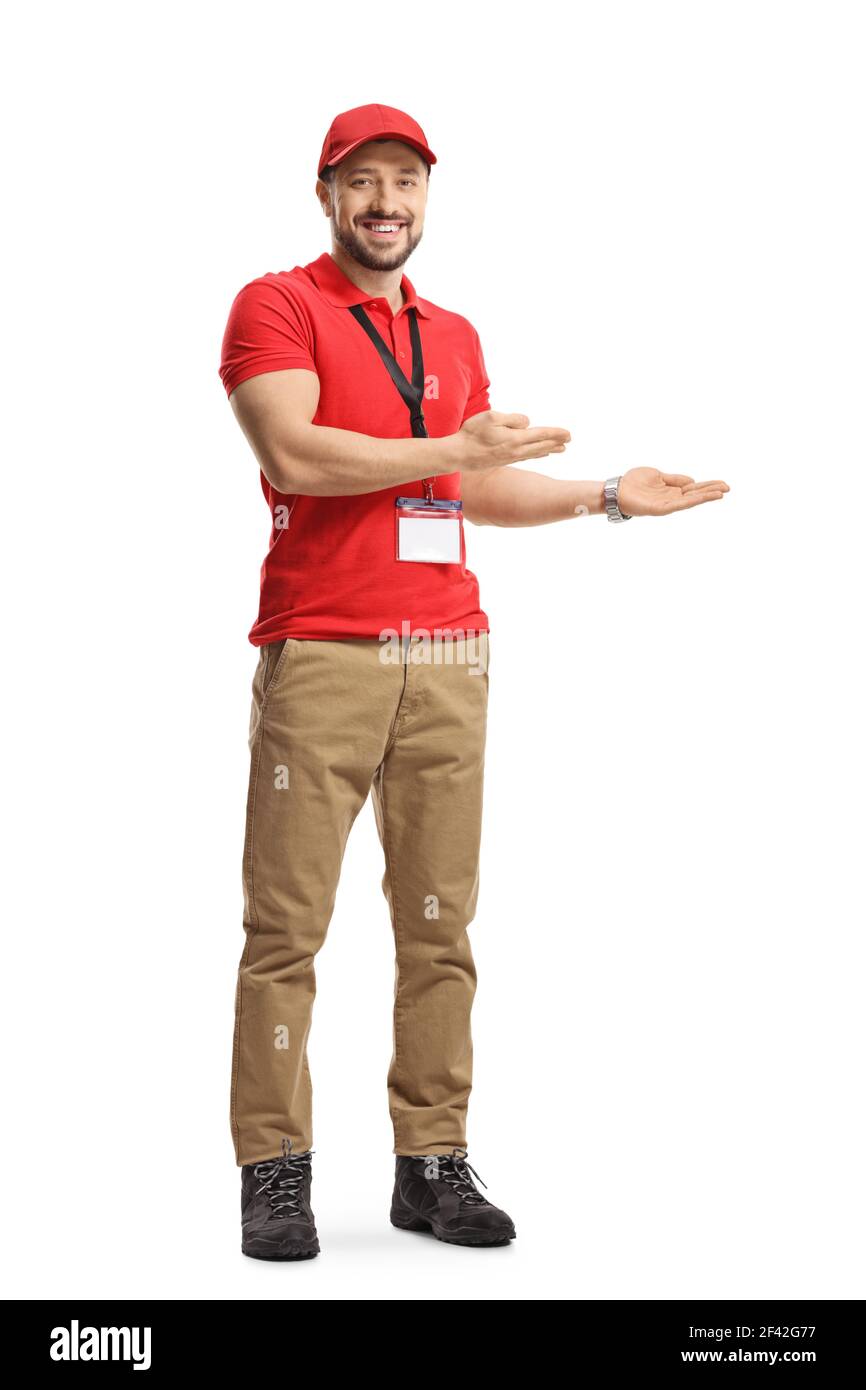 Full length portrait of a male shop assistant gesturing welcome ...