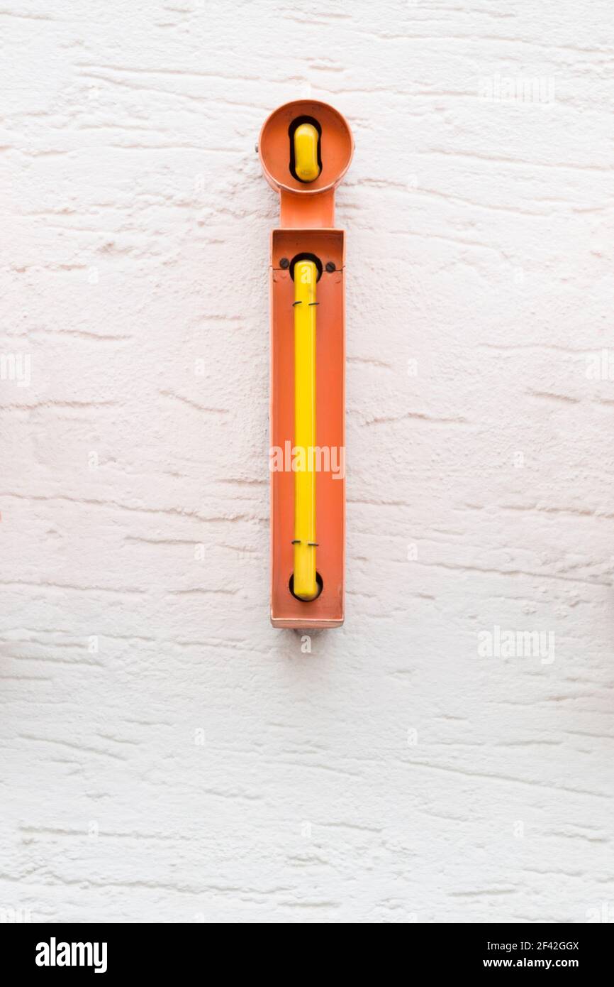 Yellow neon letter i mounted on orange-coloured metal letter Stock ...