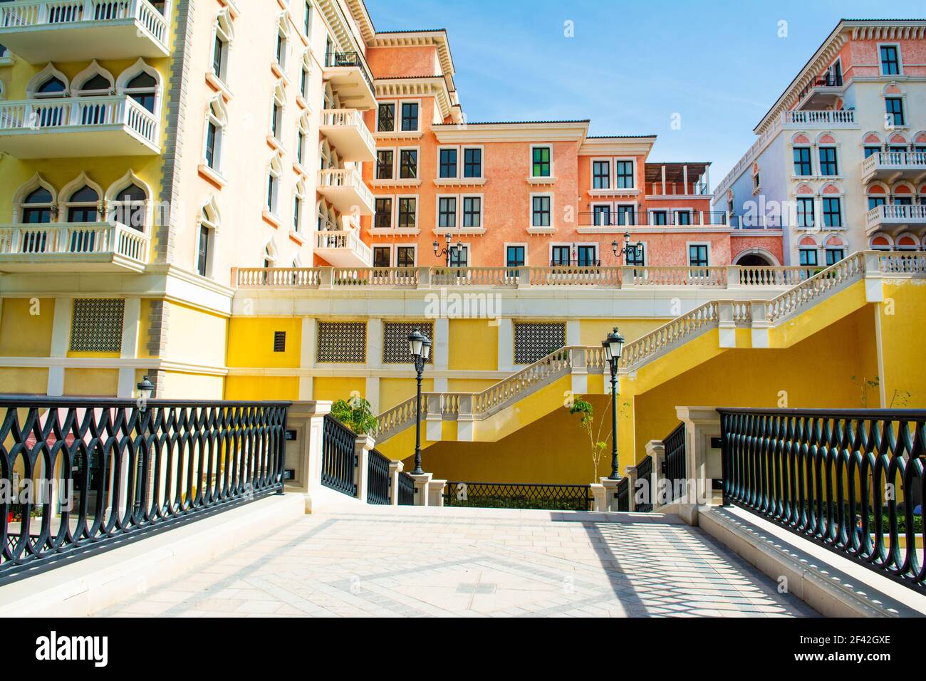 Colorful waterfront buildings in venetian style in the Qanat Quartier ...