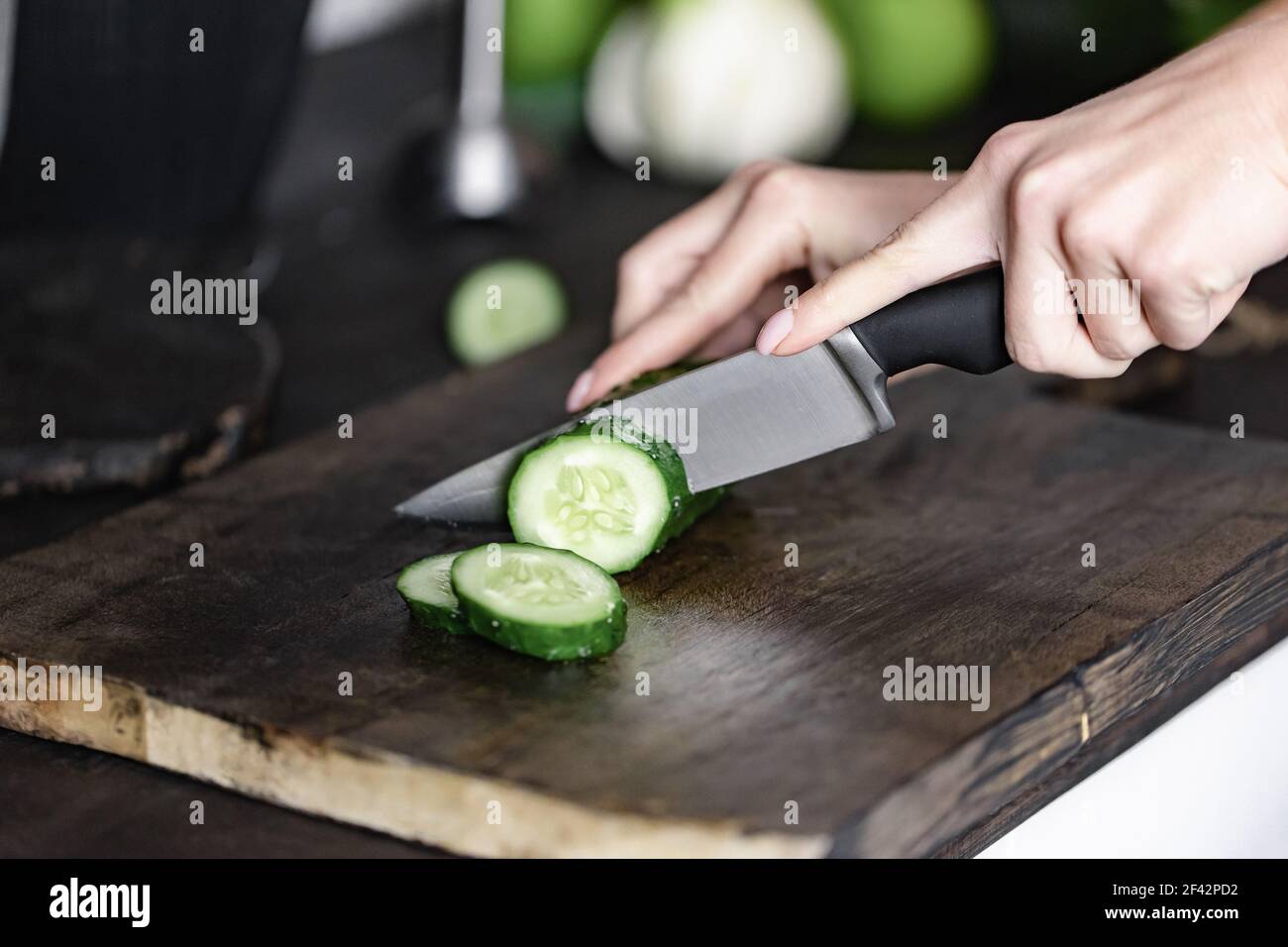 Cucumber hand hi-res stock photography and images - Alamy