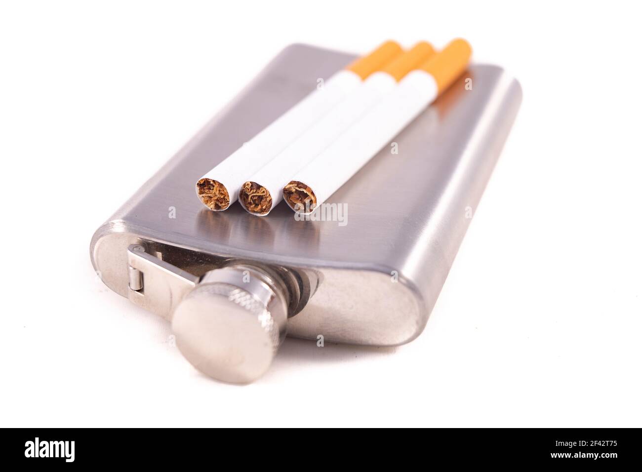 Metal flask and cigarettes. Metal container for alcohol and smoking ...