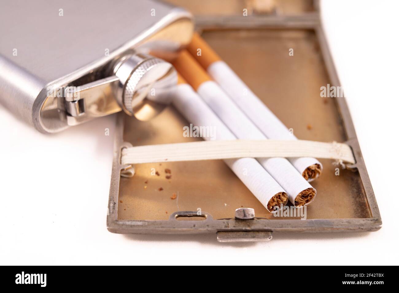 Metal flask and cigarettes. Metal container for alcohol and smoking ...