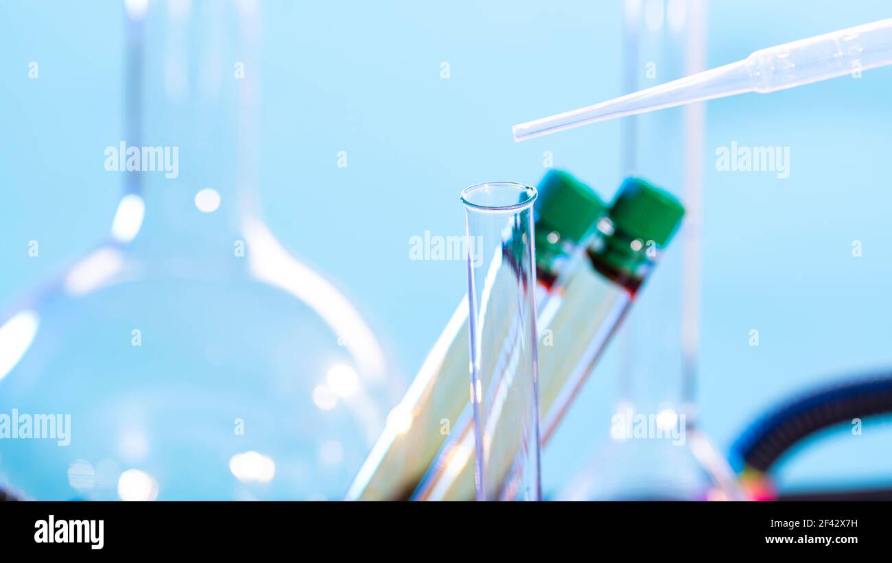 Chemical test tube and pipette close up on blue background Stock Photo ...
