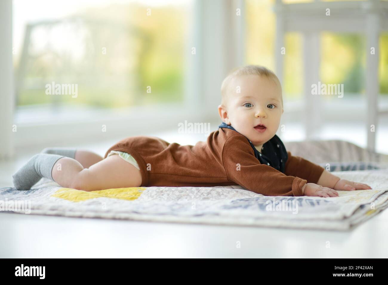 Cute five months old baby boy lying on his tummy. Baby during tummy ...