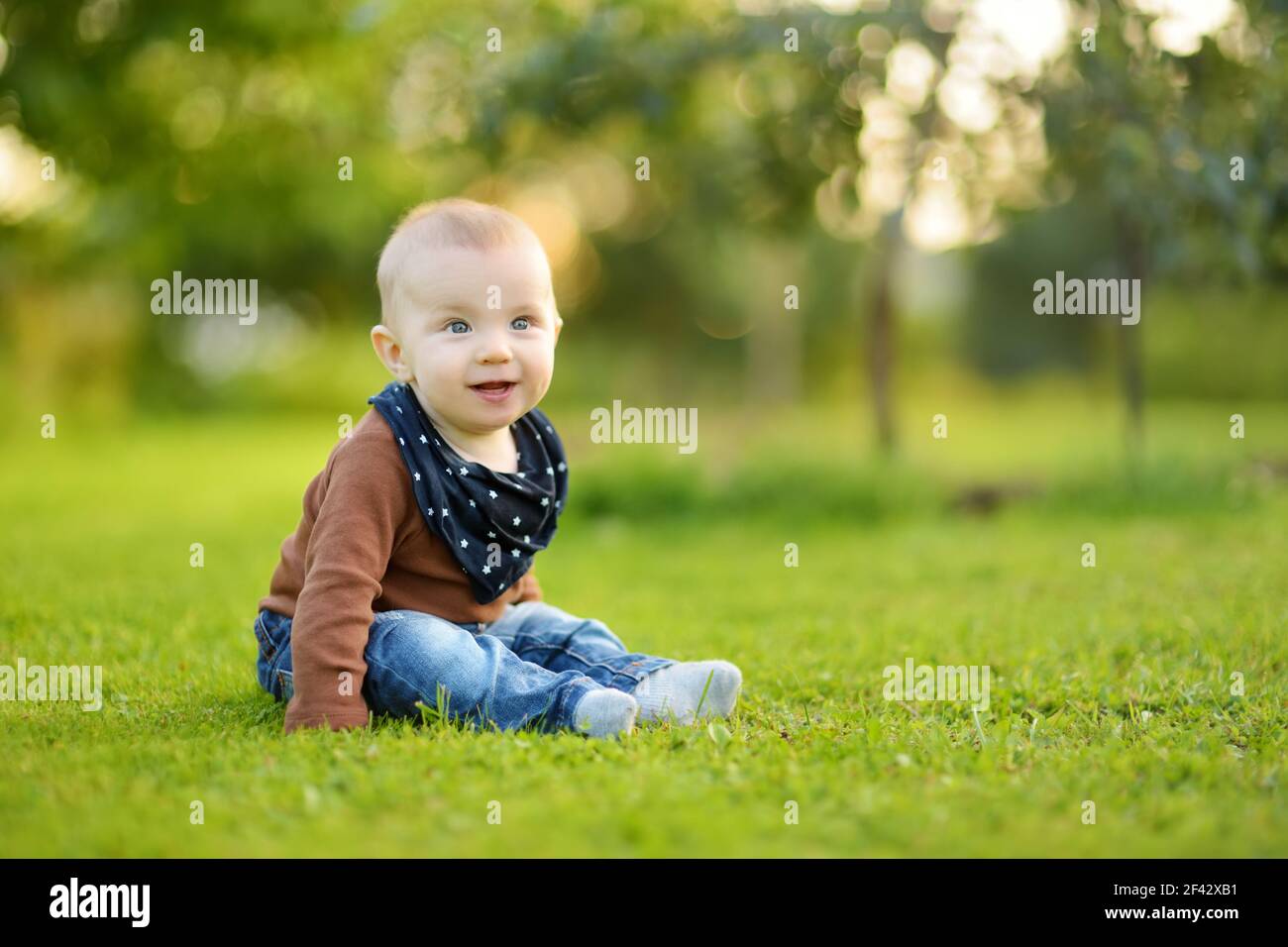 Cute five months old baby boy learning how to sit up without support ...