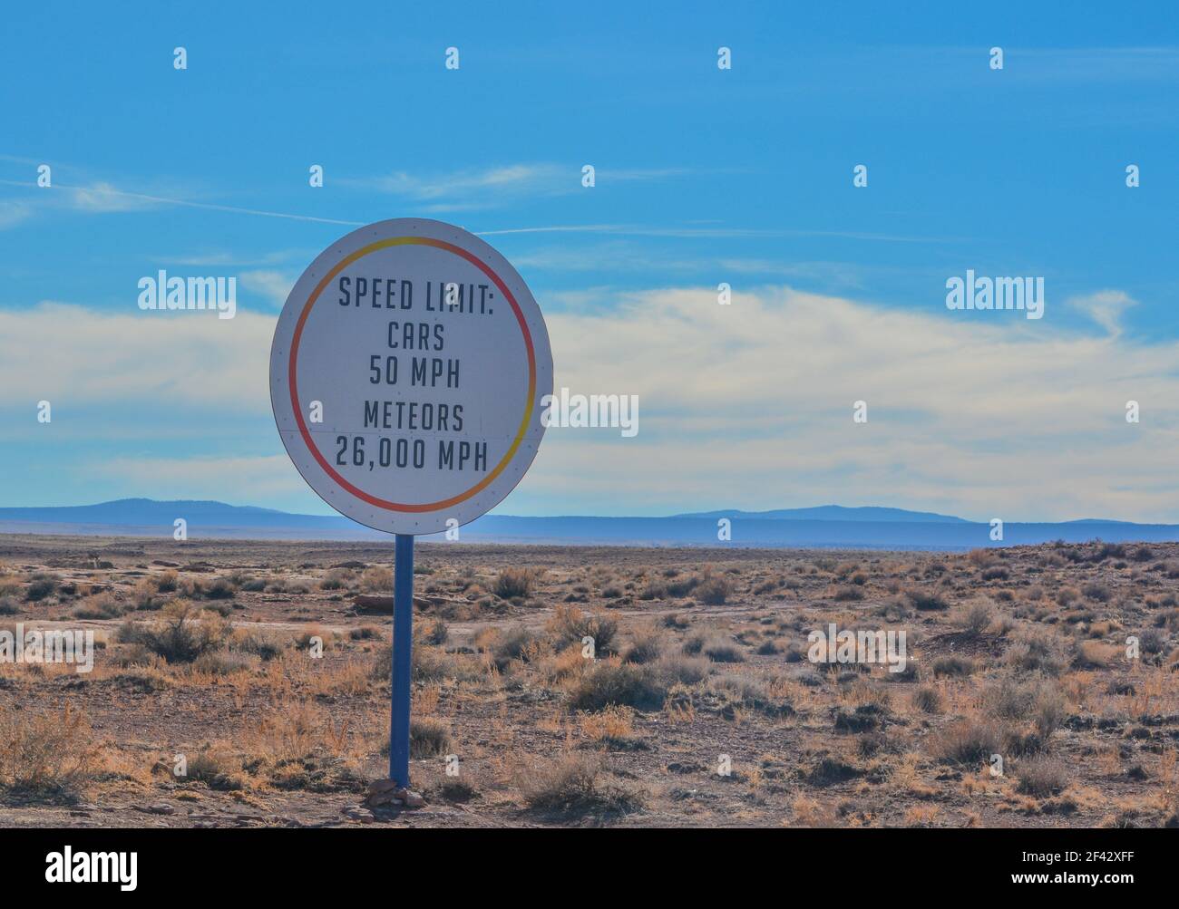 Car and Meteor speed limit sign. On the road to the Meteor Crater ...